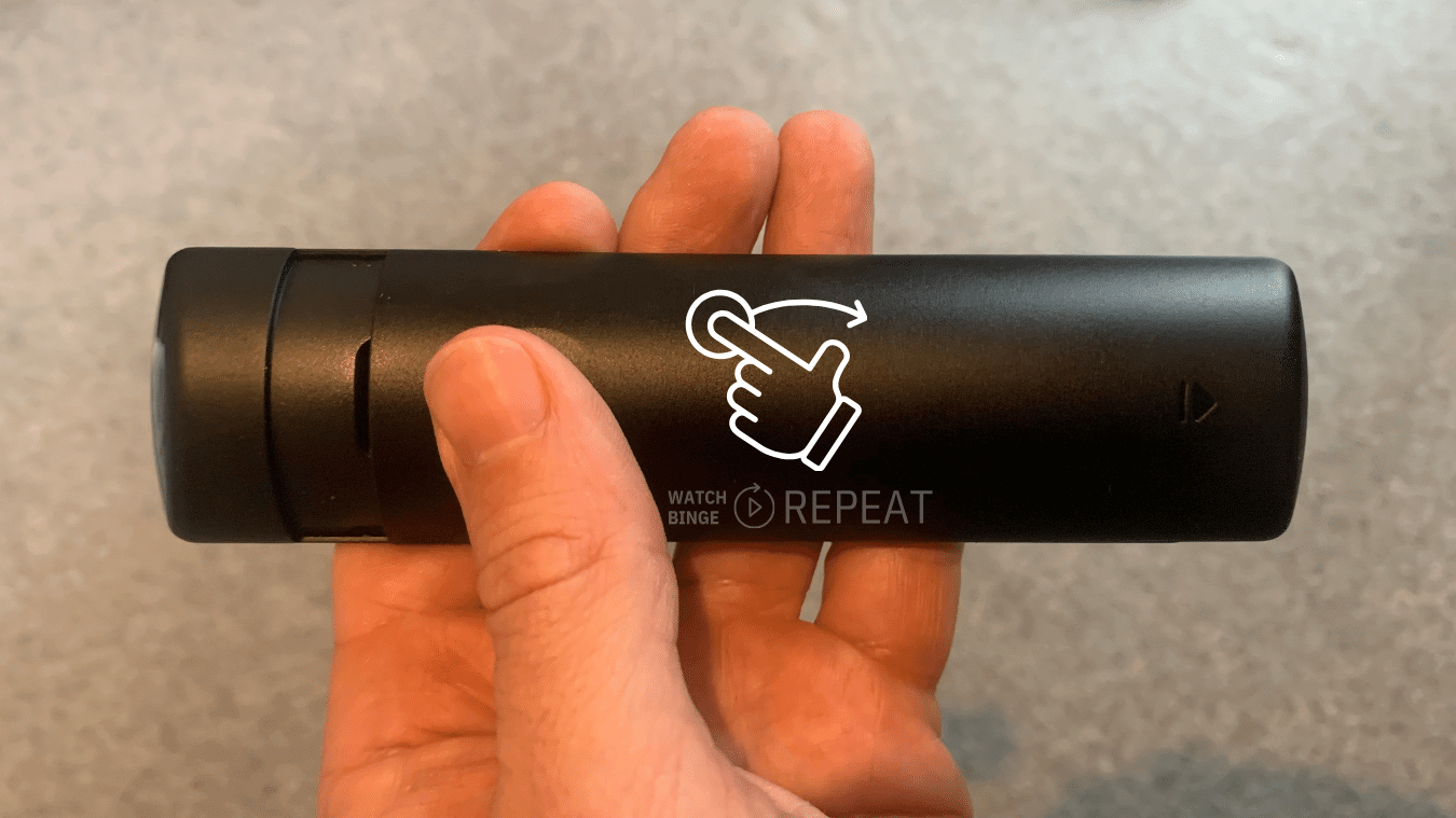 With your thumb on the triangle, gently push downwards. The cover ...